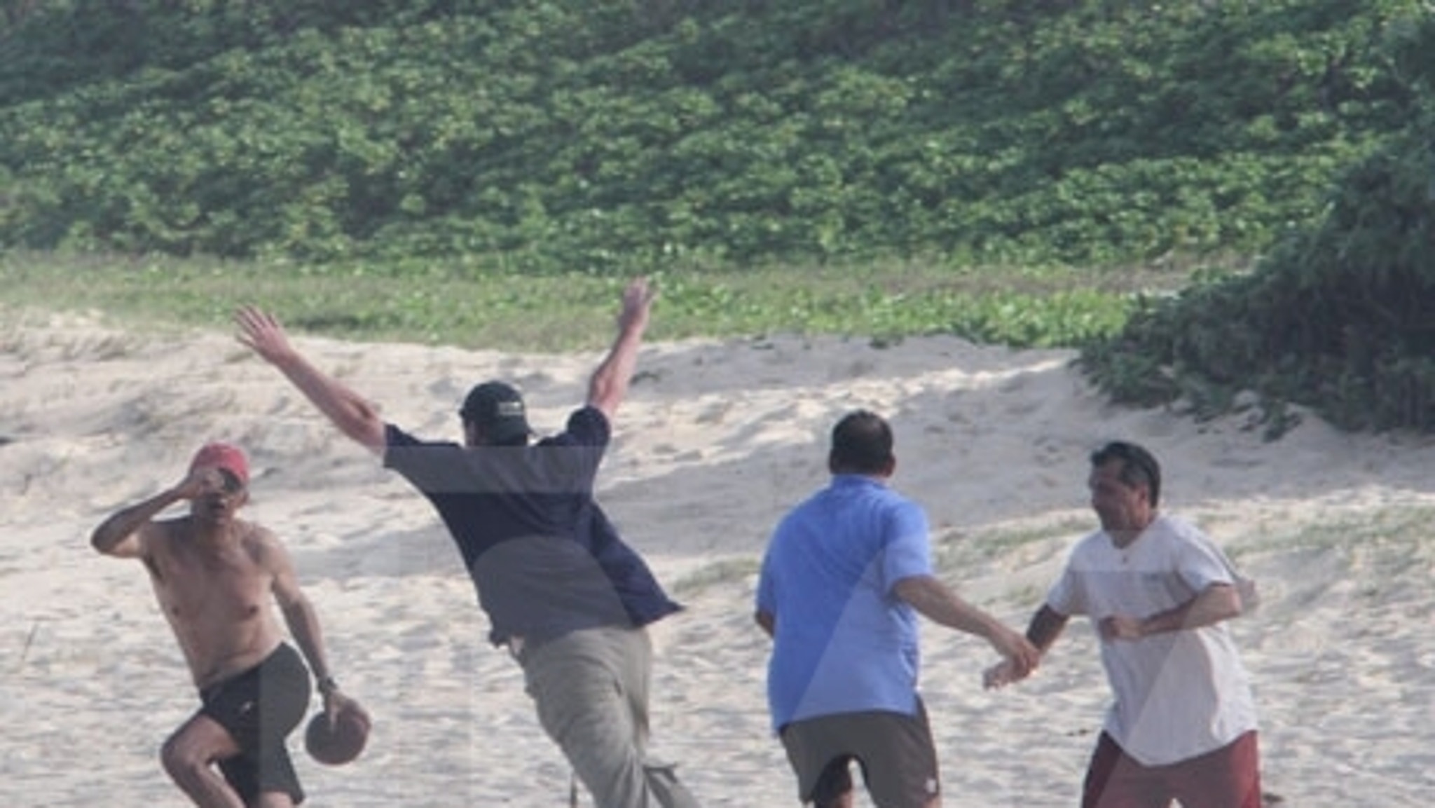 President Obama plays football in Hawaii