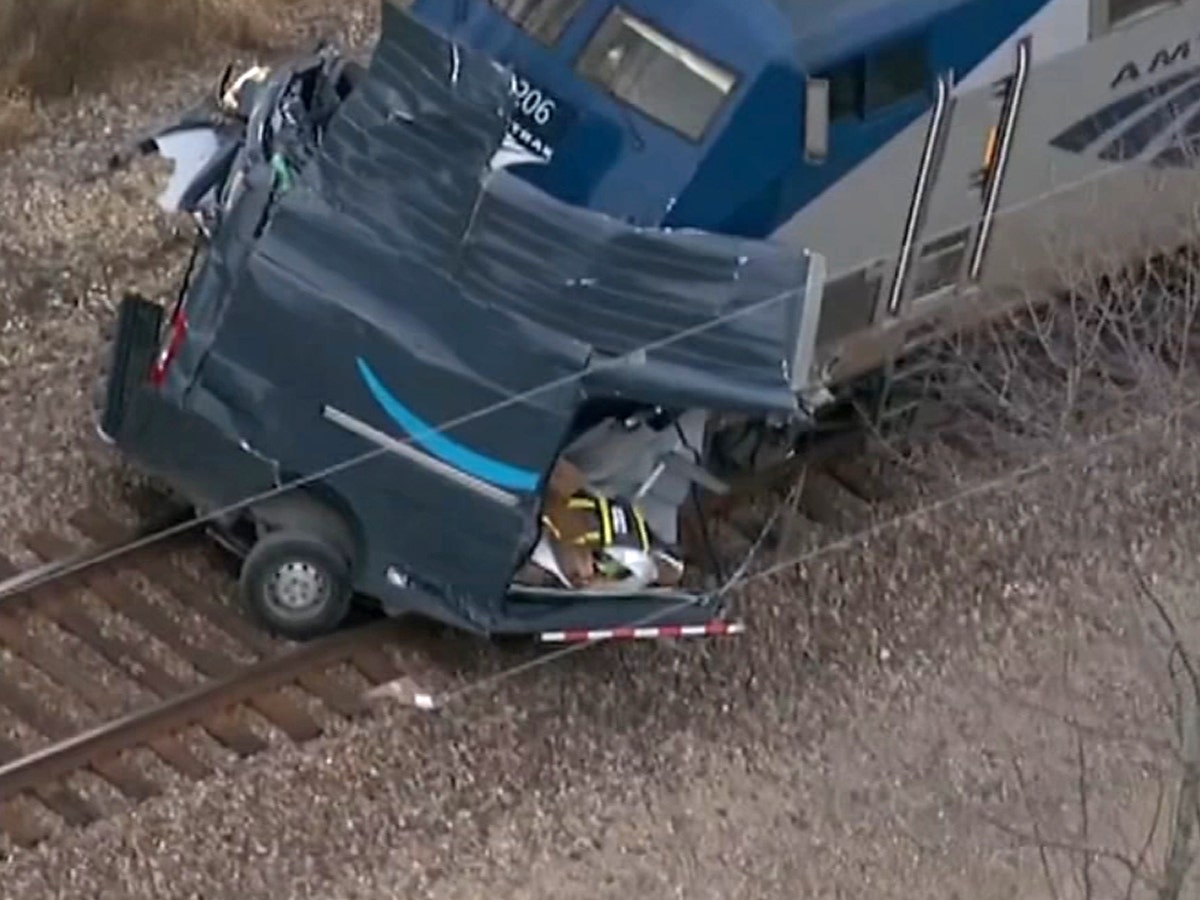 Amazon van that got split in half on a railroad track : r/CrazyFuckingVideos