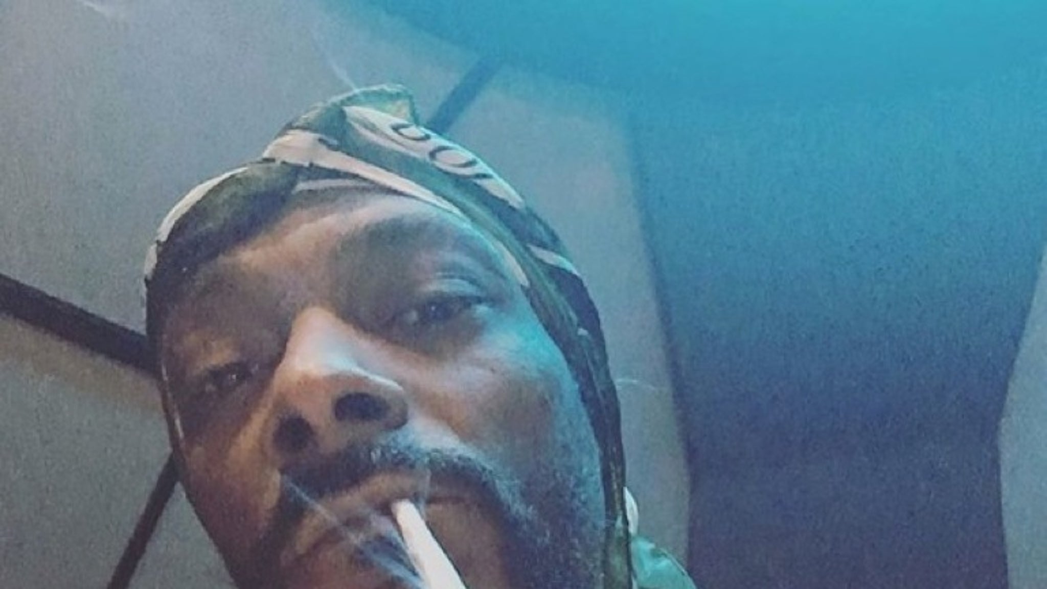 Snoop Dogg Smoking Weed Sitting Down