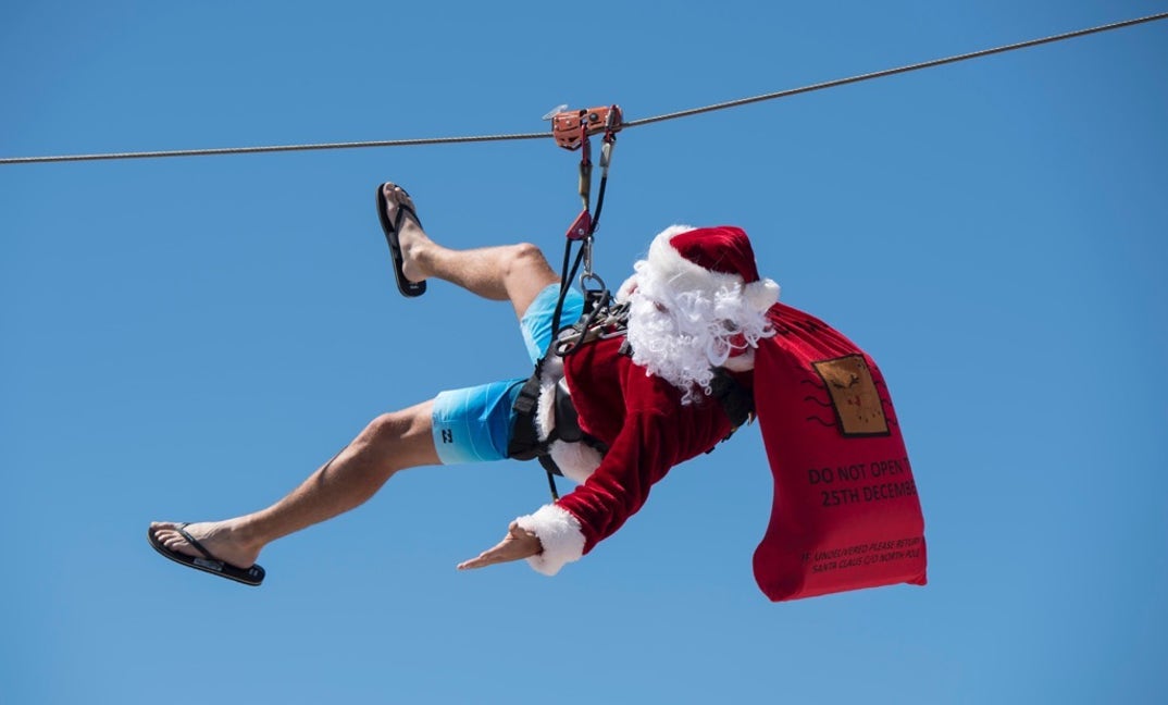 Zip Lining Santa -- Ho Ho Hold On Tight!