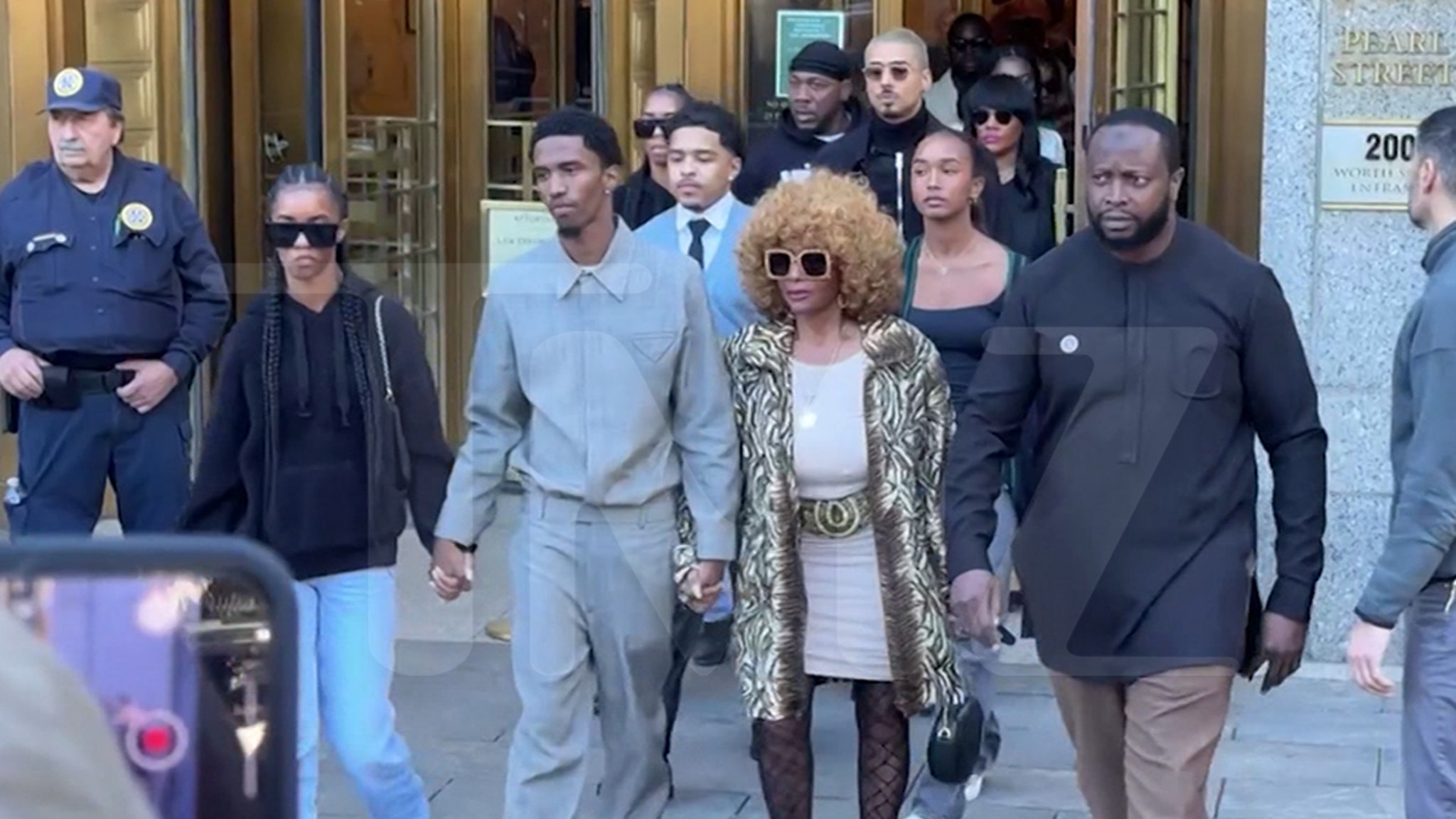 Diddy's Family Leaves Court, Arm in Arm