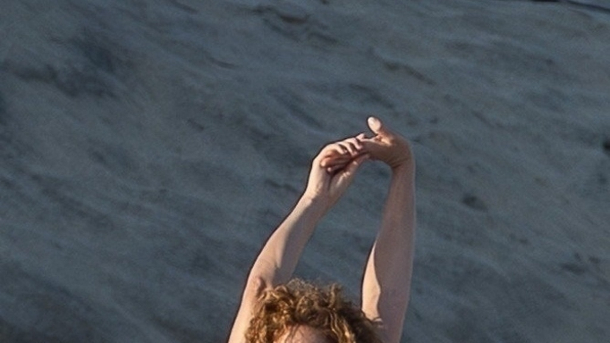 Shakira Meditates on Beach in Skimpy Metallic Pink Bikini